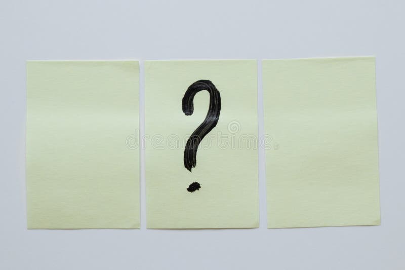 A Black Question Mark Painted on a Yellow Sticky Note with Two Blank ...