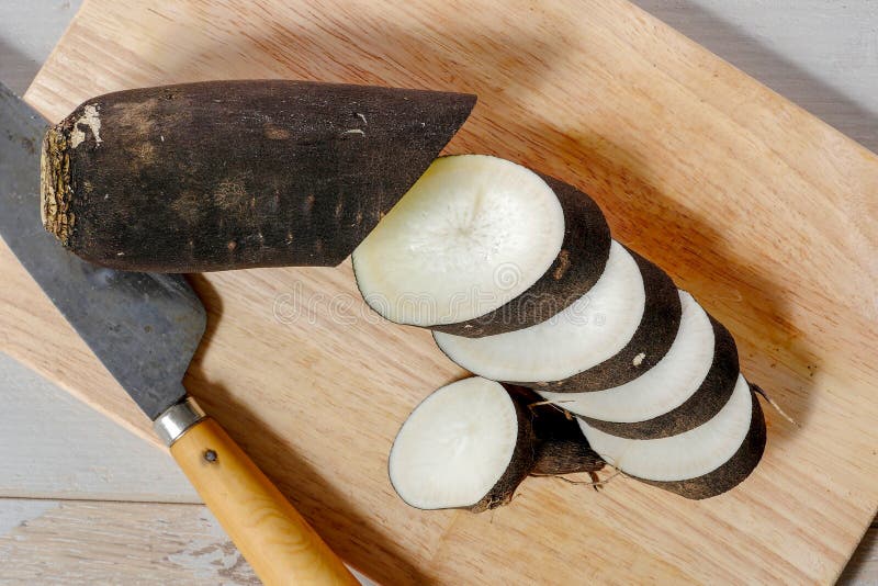 Black Radish Cutting in Slice on Wooden Board Stock Image - Image of ...