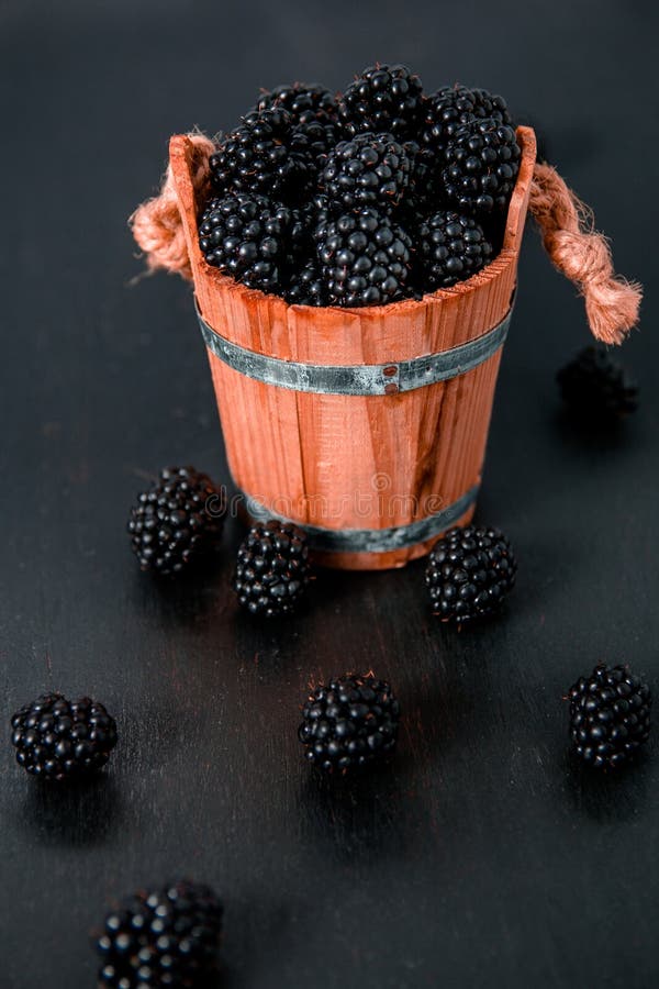 Black Raspberries in a Wooden Basket and on Table. Copy Space. Stock ...