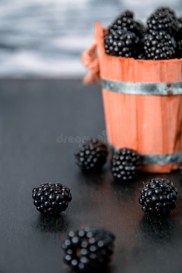 Black Raspberries in a Wooden Basket and on Table. Copy Space. Close Up ...