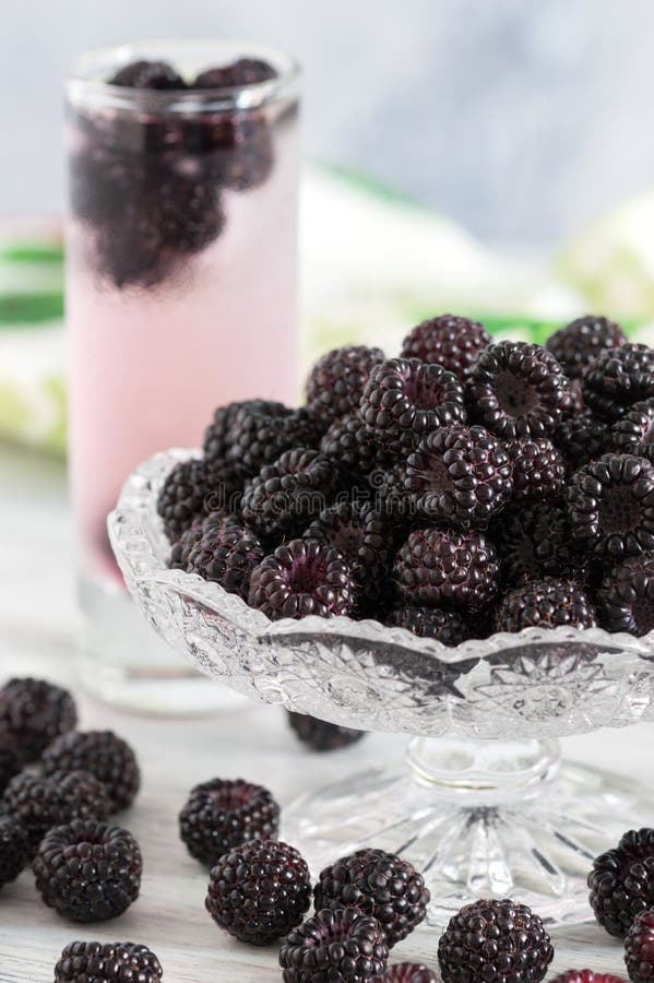 Black Raspberry In A Glass Vase And A Cold Juice From Raspberries ...