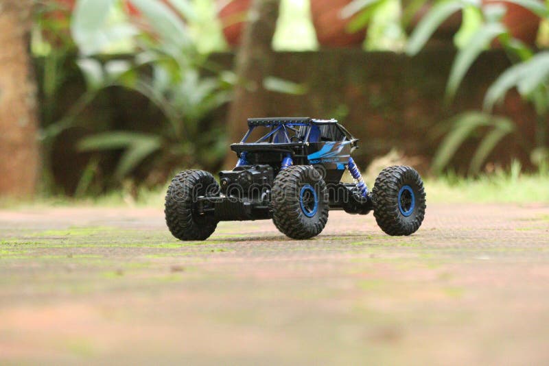 A Black RC Car Driving on the Floor Stock Image - Image of controller ...