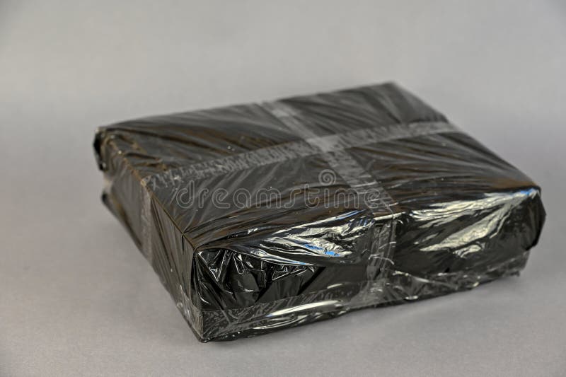 Black Rectangular Box Wrapped in Black Film Stock Photo - Image of ...
