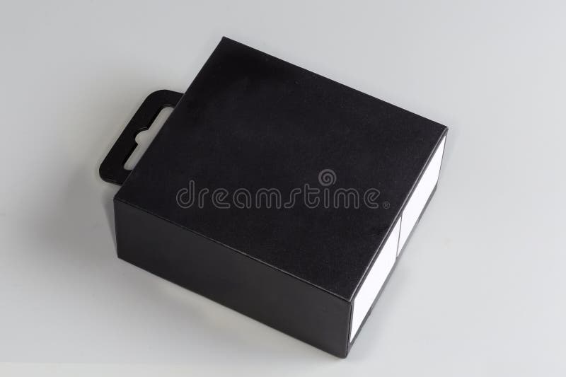 Black Rectangular Cardboard Hang Tab Packing Box on Gray Surface Stock ...