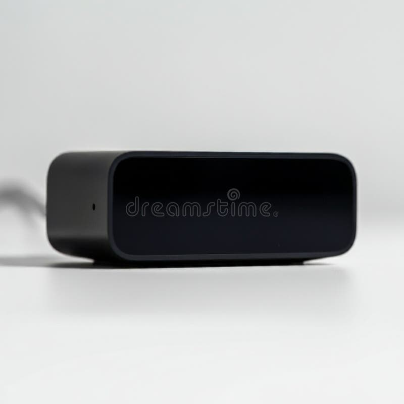 A Black Rectangular Device with Rounded Edges, Possibly an Electronic ...