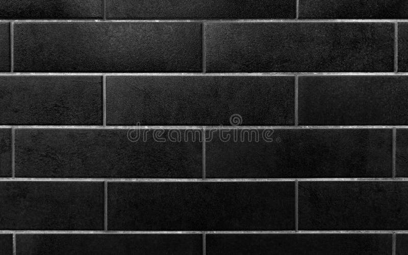 Black Rectangular Tiles Wall Background. a Close-up of a Wall Featuring ...