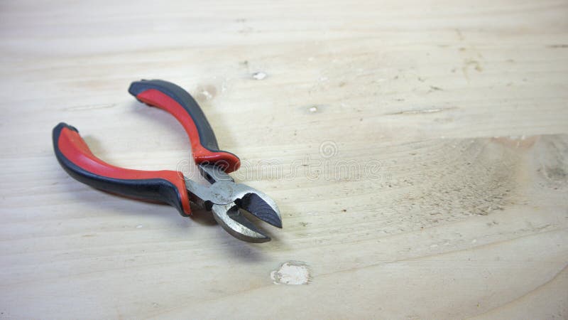 Black Red Handle Mini Wire Cutting Pliers with Wooden Base Stock Photo ...