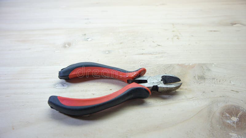 Black Red Handle Mini Wire Cutting Pliers with Wooden Base Stock Photo ...