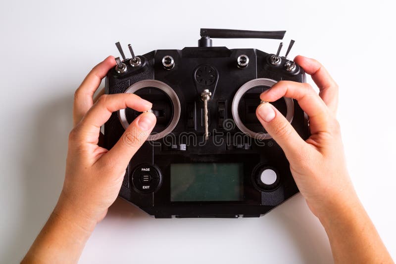 Black Remote Control Panel and Hands on Controls for Drone. Top View on ...