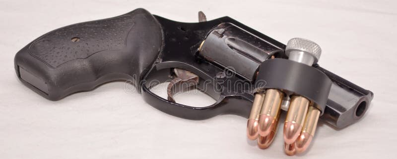 A Revolver With A Speed Loader Stock Photo - Image of black, loading ...