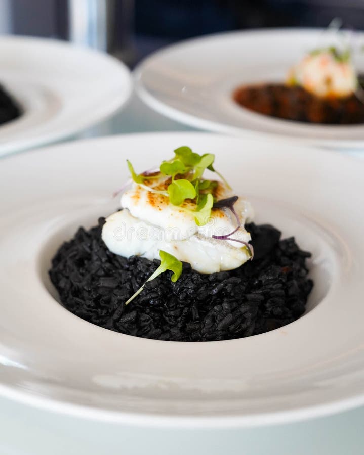 Black Rice with Cuttlefish and Squid Ink Stock Photo - Image of baking ...