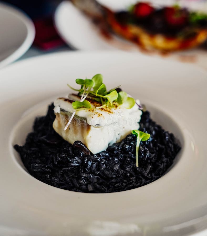 Black Rice with Cuttlefish and Squid Ink Stock Photo - Image of meat ...