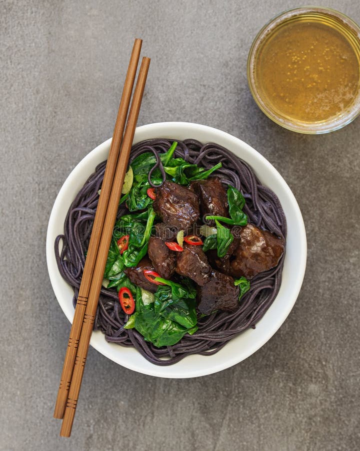 Black Rice Noodles with Pork and Spinach Stock Photo - Image of organic ...
