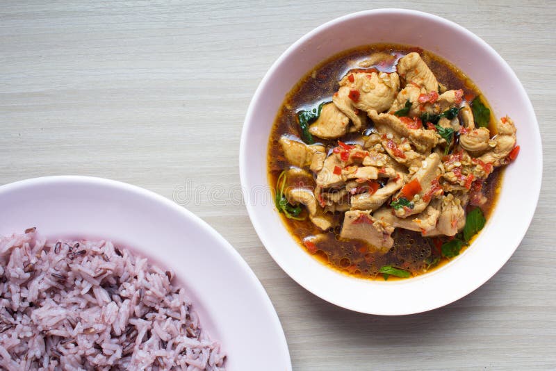 Black Rice Spicy Fried Chicken with Basil Leaves Stock Image - Image of ...