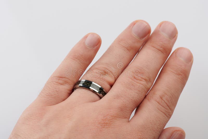 Black ring on man finger stock photo. Image of body - 149330662