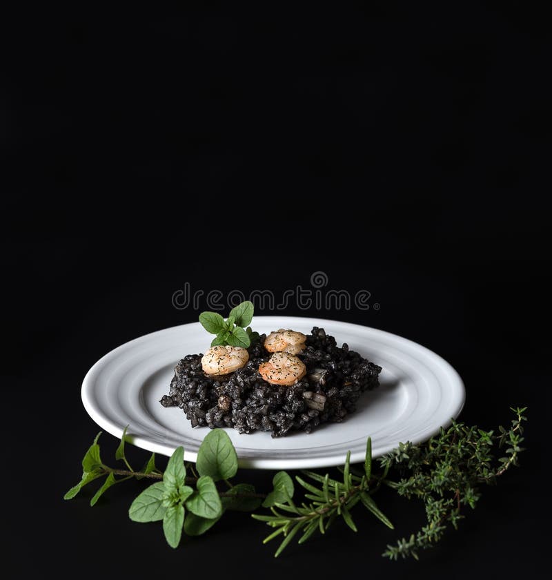 Black risotto and herbs stock image. Image of dramatic - 61144781