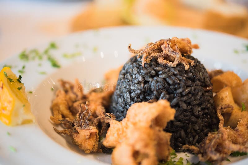 Black risotto with seafood stock photo. Image of fried - 49230444