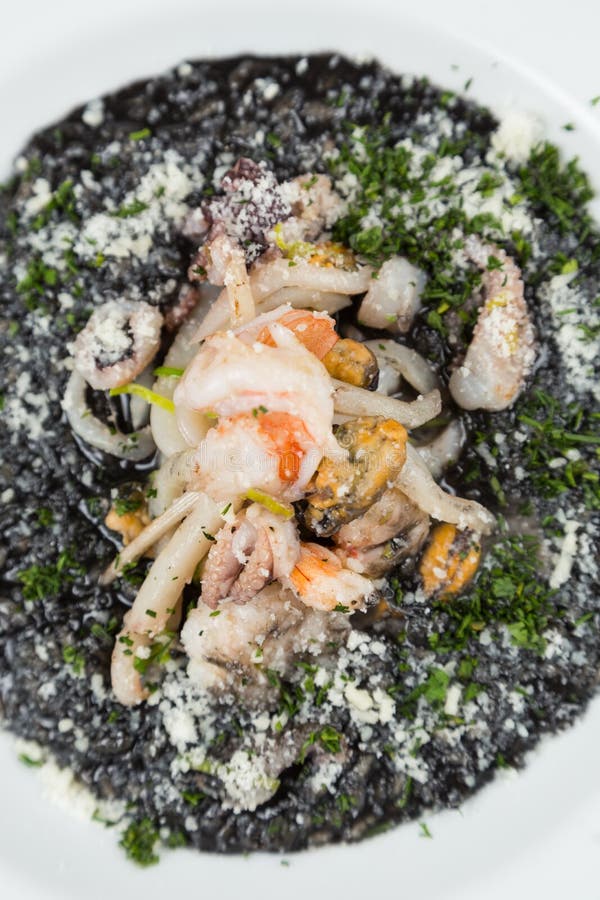 Black risotto with seafood stock image. Image of food - 57696081