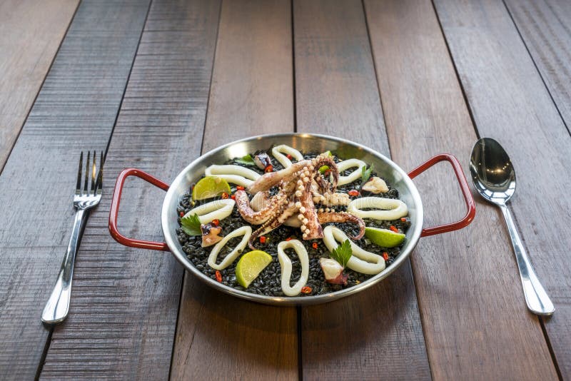 Black Risotto with Squid and Ink Sauce Stock Image - Image of famous ...