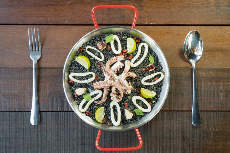 Black Risotto with Squid and Ink Sauce Stock Image - Image of cherry ...
