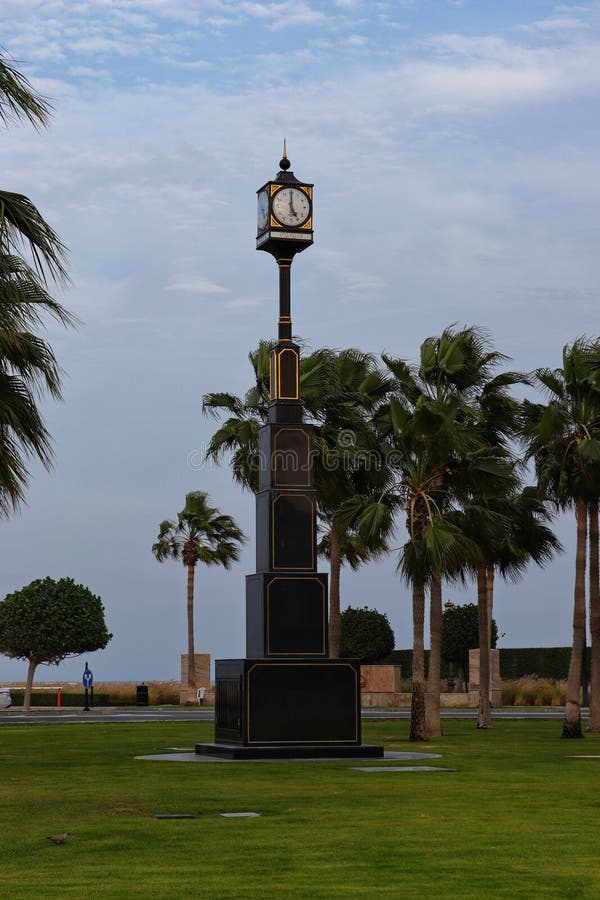 Road clock tower sculpture stock image. Image of lighting - 275482807