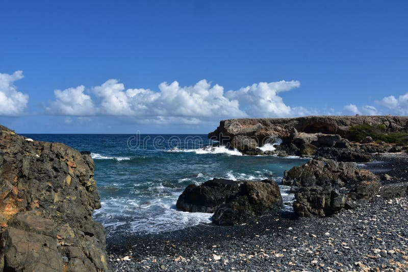 Black Rock Beach in Aruba Under Blue Skies Stock Photo - Image of ...