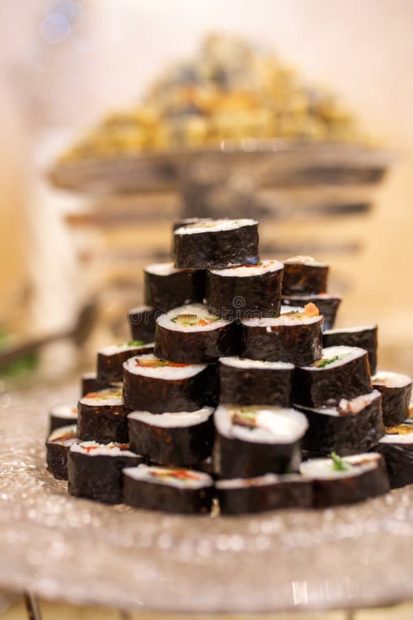 Black Roller Rolls on a Plate in a Cafe. Stock Image - Image of graphic ...
