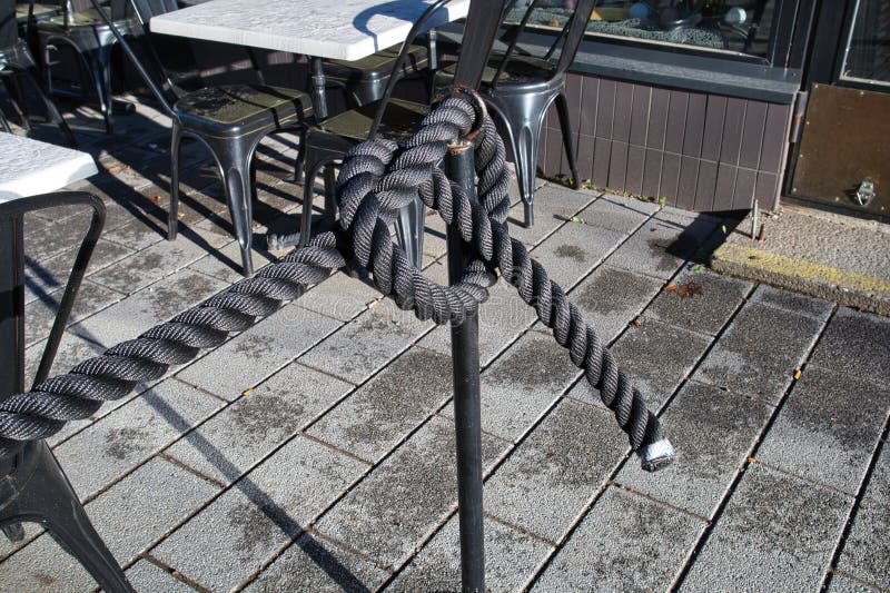 Black Rope with Knot Around Outdoor Restaurant Stock Image - Image of ...