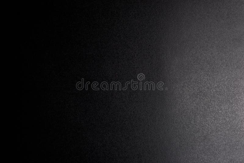 Black, Rough Textured Background Lit with Dim Light. Stock Photo ...