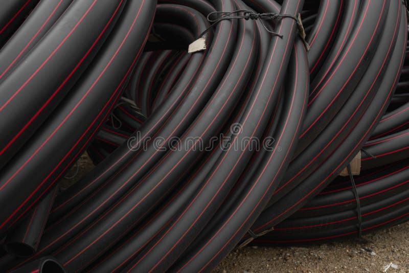 Black Rubber or Plastic Pipes with a Red Lines As a Construction ...