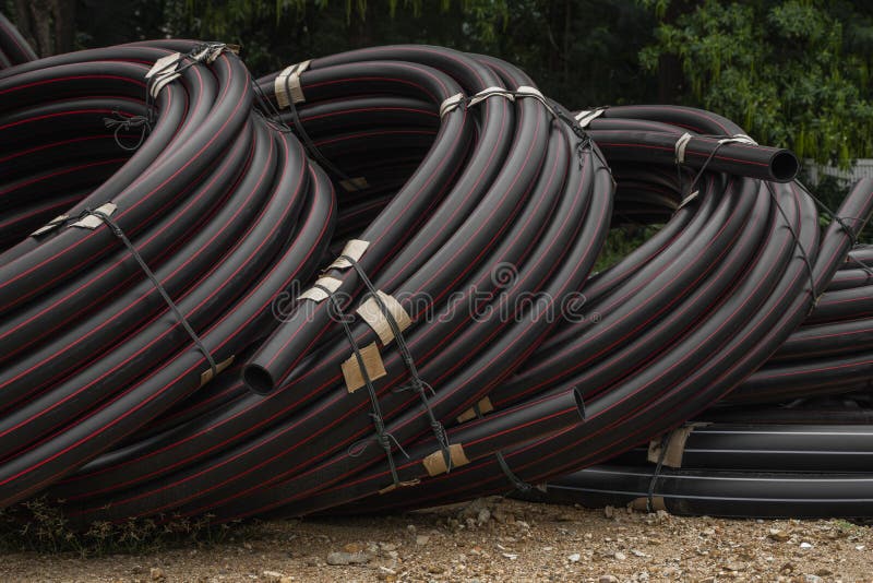 Black Rubber or Plastic Pipes with a Red Lines As a Construction ...