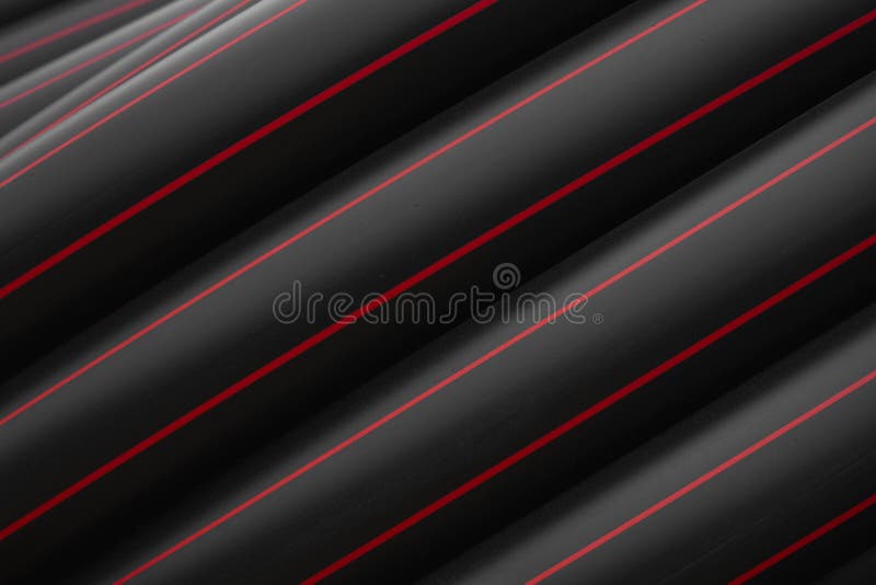 Black Rubber or Plastic Pipes with a Red Lines As a Construction ...