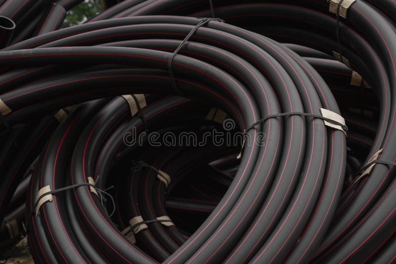 Black Rubber or Plastic Pipes with a Red Lines As a Construction ...