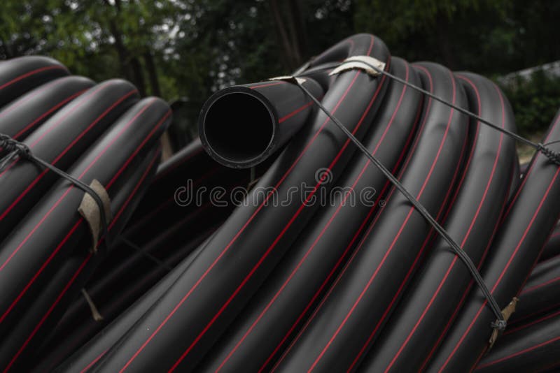 Black Rubber or Plastic Pipes with a Red Lines As a Construction ...