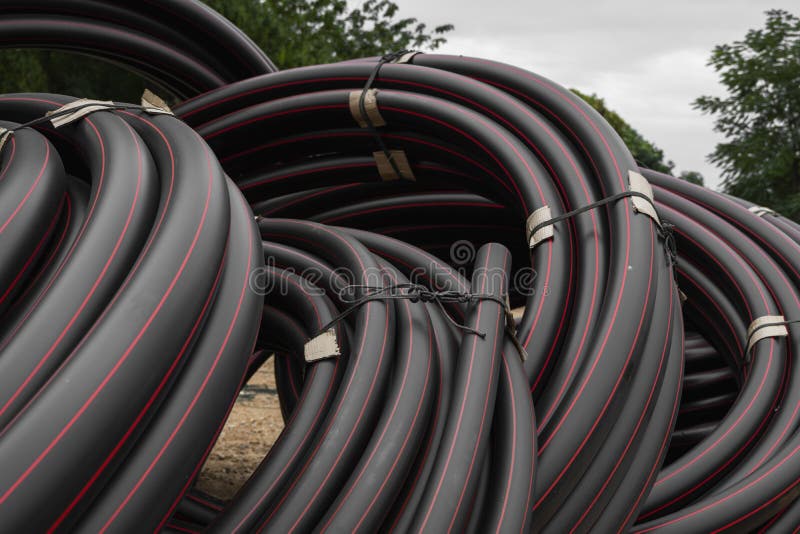 Black Rubber or Plastic Pipes with a Red Lines As a Construction ...