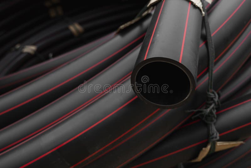 Black Rubber or Plastic Pipes with a Red Lines As a Construction ...