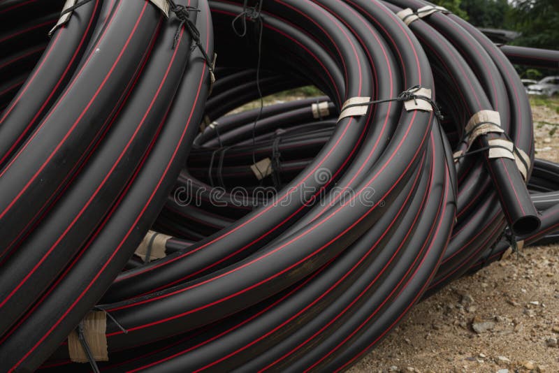 Black Rubber or Plastic Pipes with a Red Lines As a Construction ...