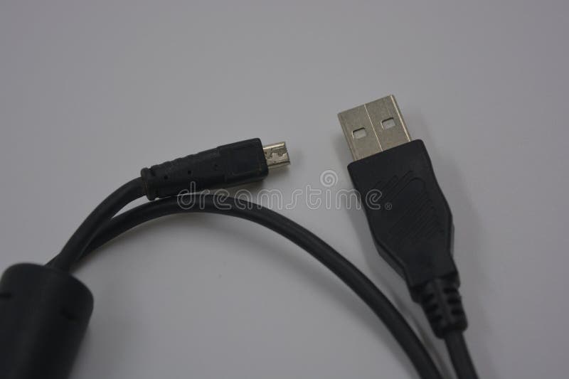 Black Rubber, Plastic Usb Cable and Micro Usb are Located on a White ...