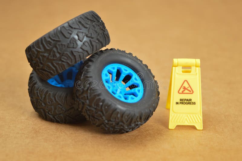 Black Rubber Tires and Repair in Progress Signage Stock Photo - Image ...