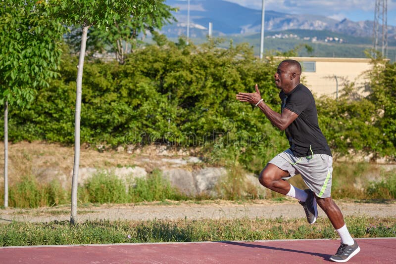 Black Runner Training in a Park Stock Image - Image of legs, exercise ...