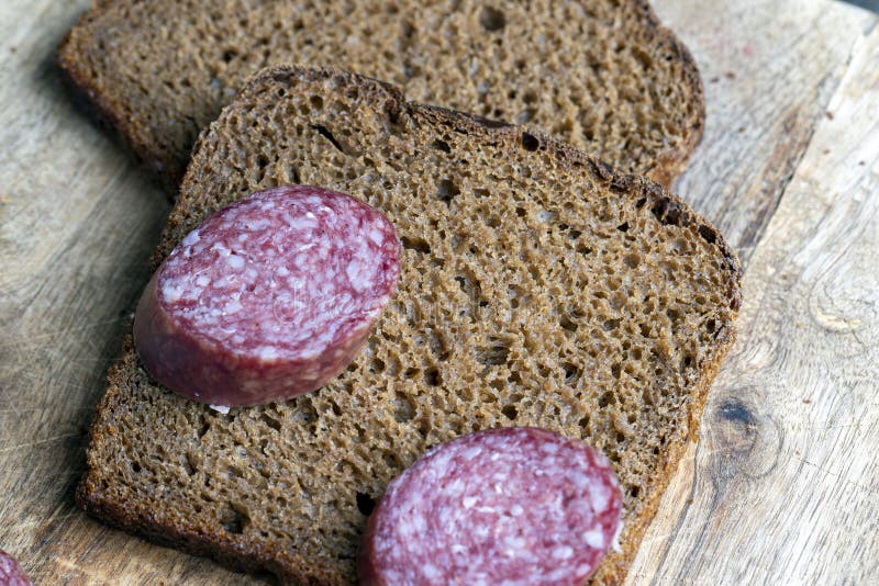 Black rye bread on a board stock photo. Image of cutout - 283118296
