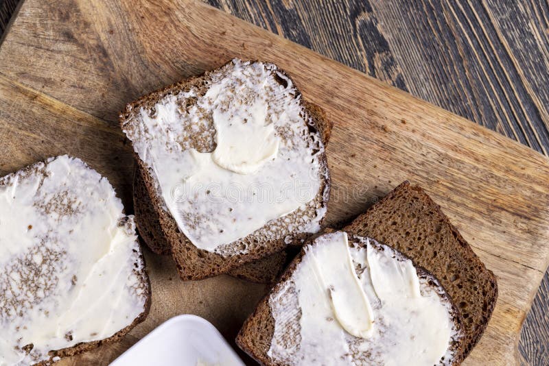 Black Rye Bread with Butter Stock Image - Image of bread, milk: 259562005