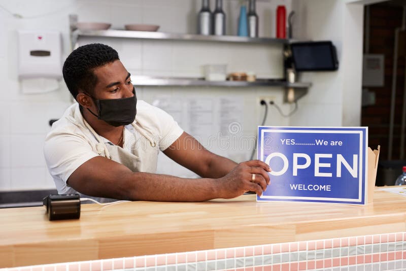 Black Salesman Put Open Sign on Table Stock Photo - Image of retail ...