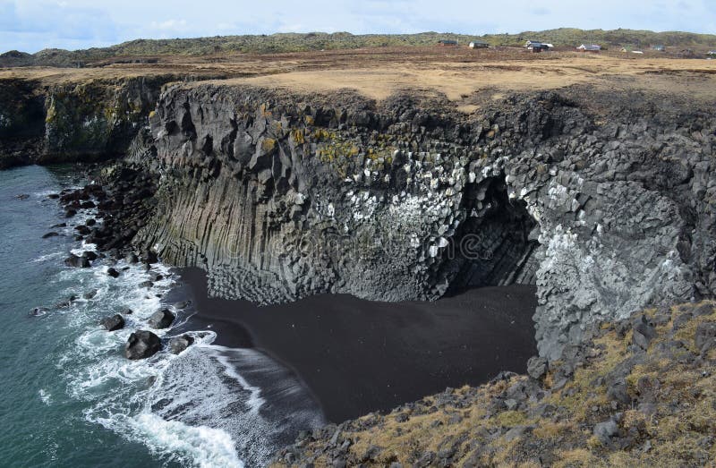 Black Sand Beach with Basalt Column Cavern Along Iceland`s Coast Stock ...