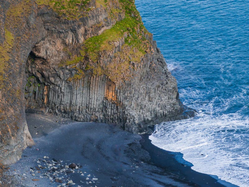 Black Sand Beach with Basalt Columns and Cliffside Cave in Iceland ...