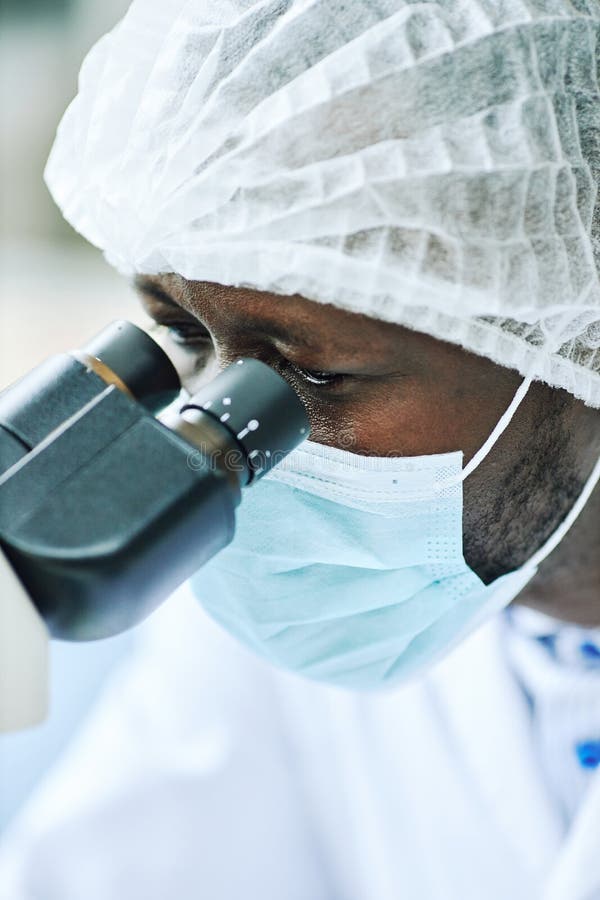 Black Scientist Looking in Microscope, Stock Photo - Image of examining ...