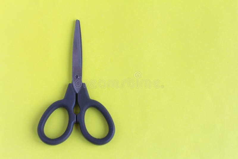 Black Scissors on a Yellow Background.Small Scissors for Cutting Stock ...