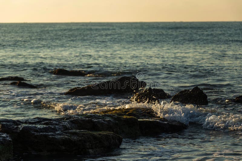 Black sea and rocks stock photo. Image of dusk, froth - 120101758
