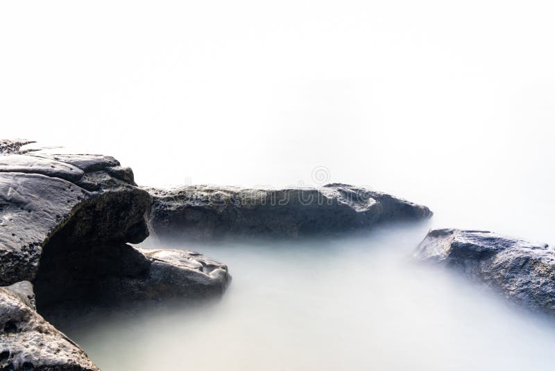Black Sea Rocks with Water Mist Long Exposure Shot Stock Image - Image ...