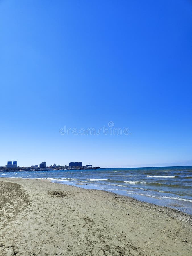 The Black Sea in Spring with Waves and Sand on the Beach with a Bright ...